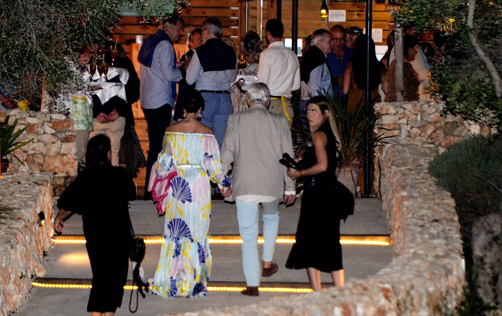 Isabel Preysler dazzling in her 'hippie' bateau neckline dress at the pre-wedding of Manuel Valls and Susana Gallardo