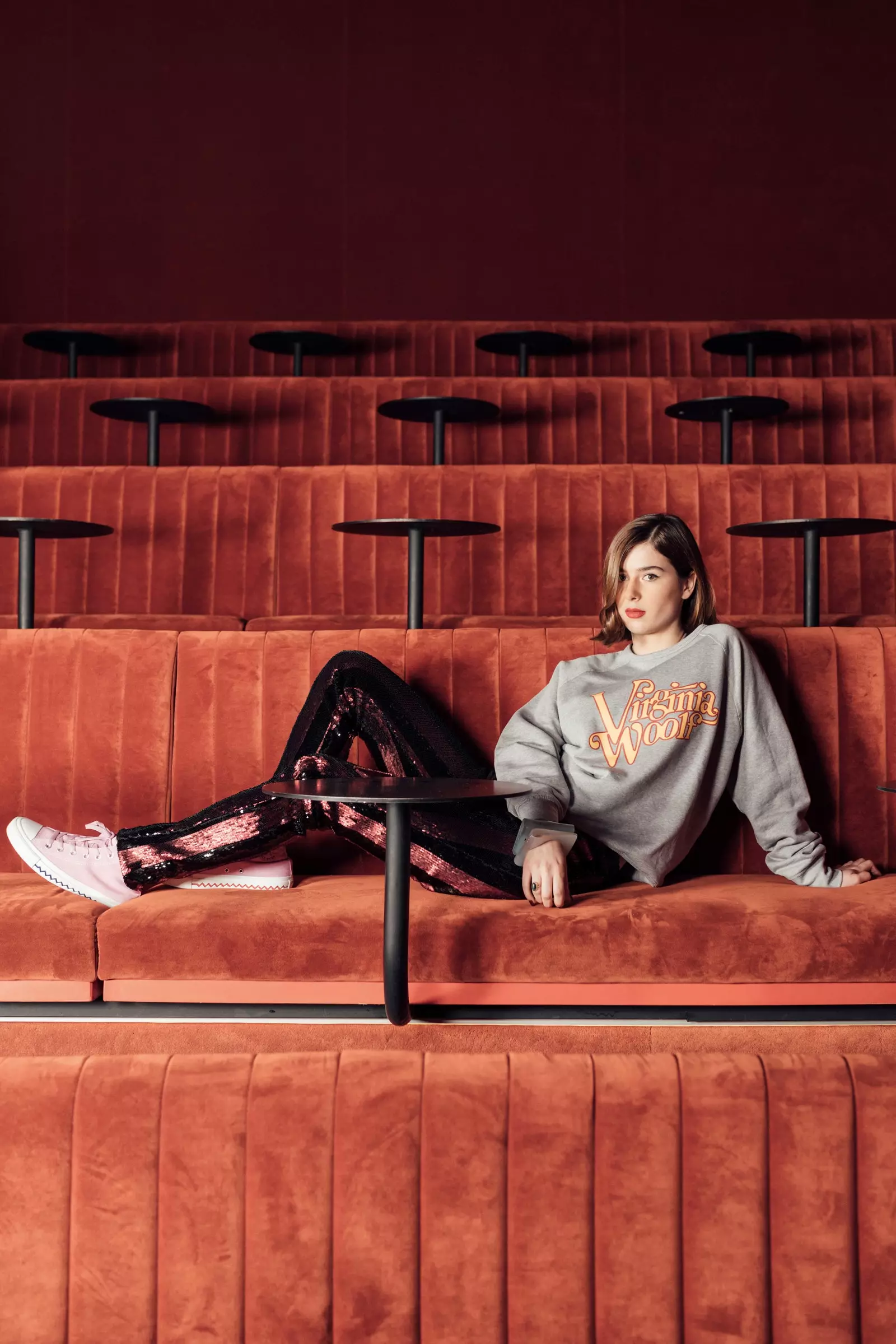 Elsa poses with a Paco Pintón sweatshirt and pants and Converse sneakers.