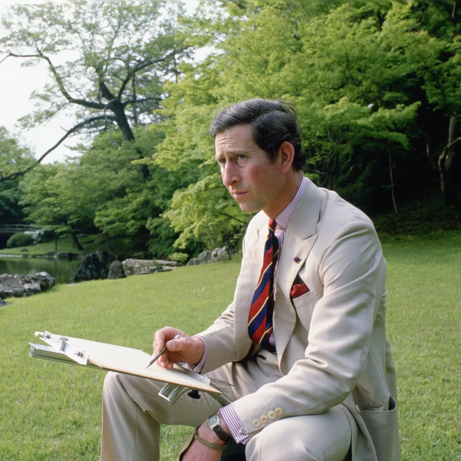 The prince painting watercolors during his visit to Japan in 1986