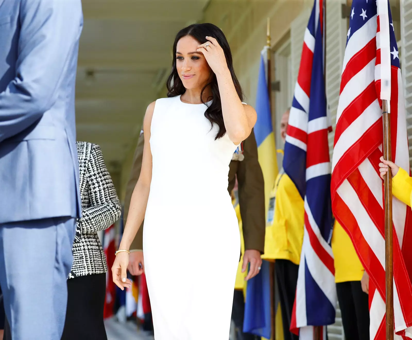 Meghan Markle într-o rochie albă spectaculoasă după ce și-a anunțat sarcina