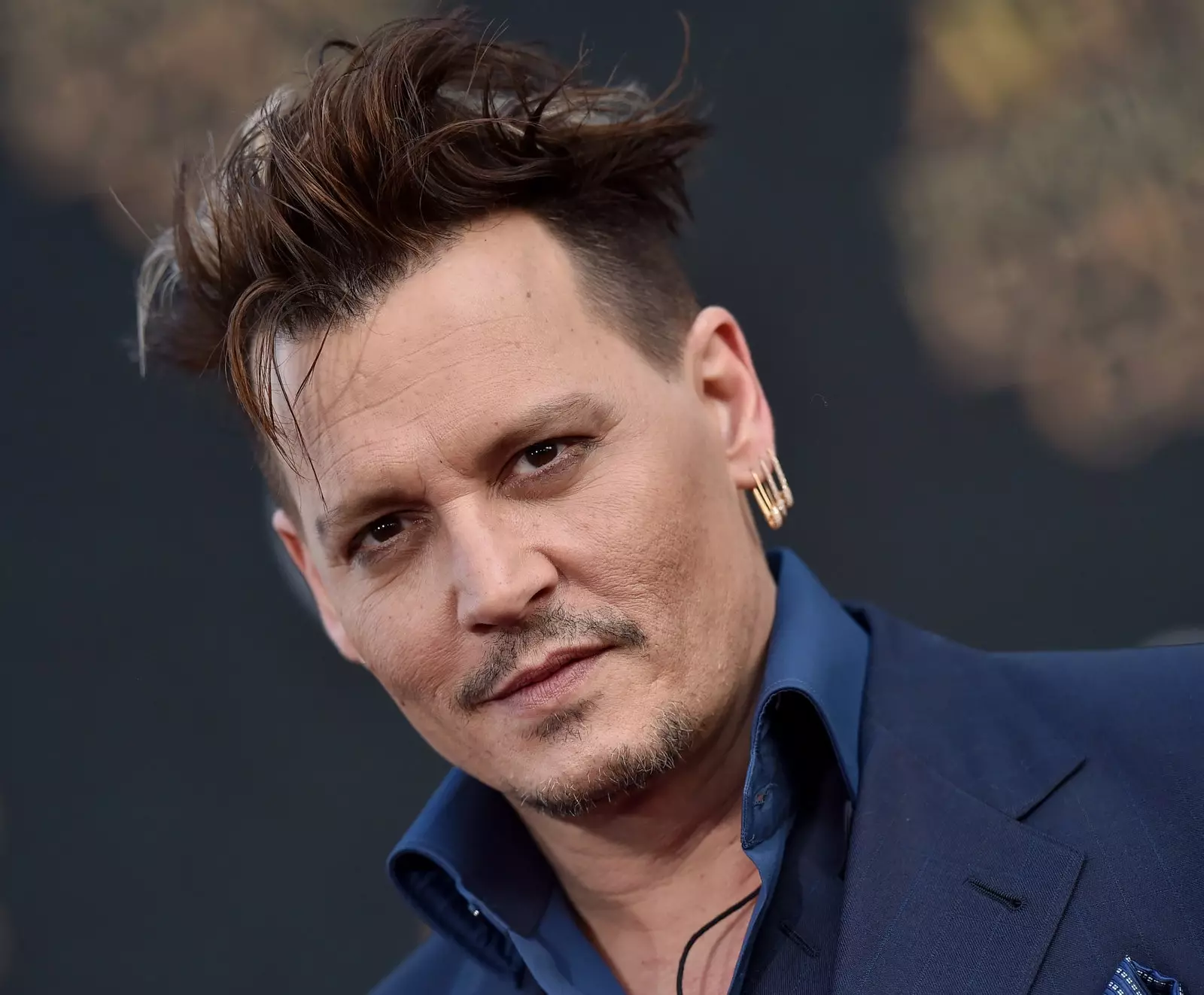 Johnny Depp bekent dat it pynlik wie om as geweldd te wurde bestimpele