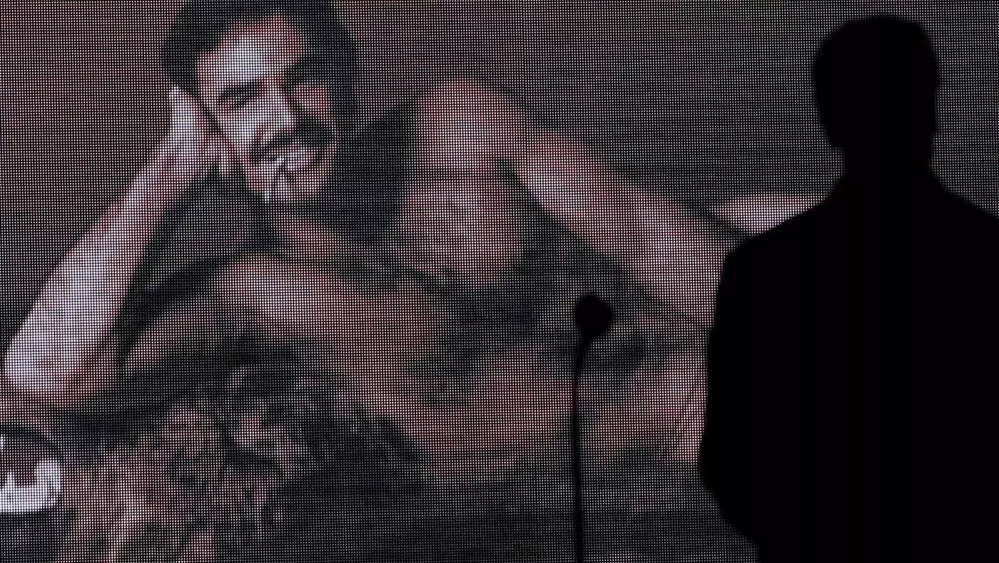 Arnold Schwarzenegger photographed in front of the iconic nude image of Burt Reynolds during the Taurus World Awards...